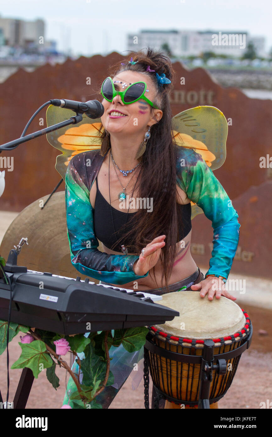 Serenity Sam of Cosmic Chords, singing with Microphone. Multi ...