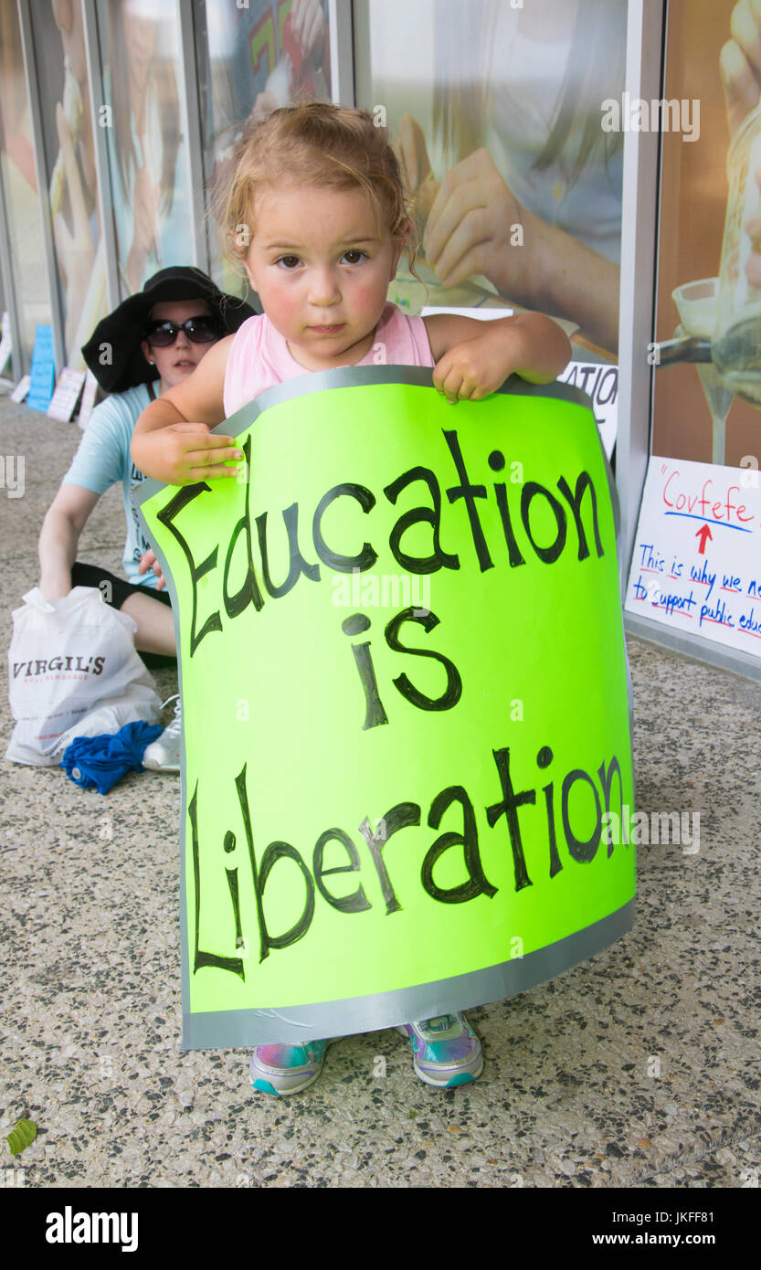 "Education is Liberation" says the sign held by Alexis, age 2, at the ...