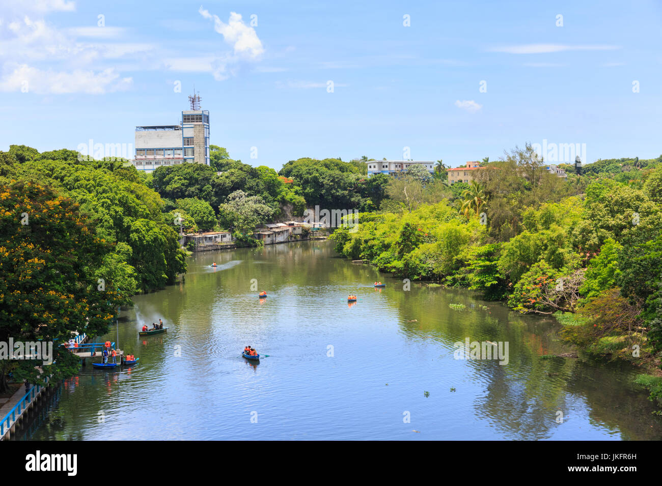 People enjoy boat rides on the river Almedares in Parque Almedares ...