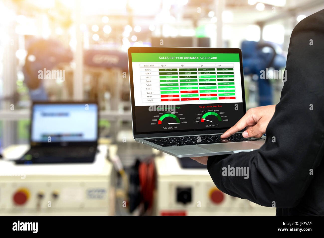 Male manager hand suit using laptop with machine real time monitoring ...