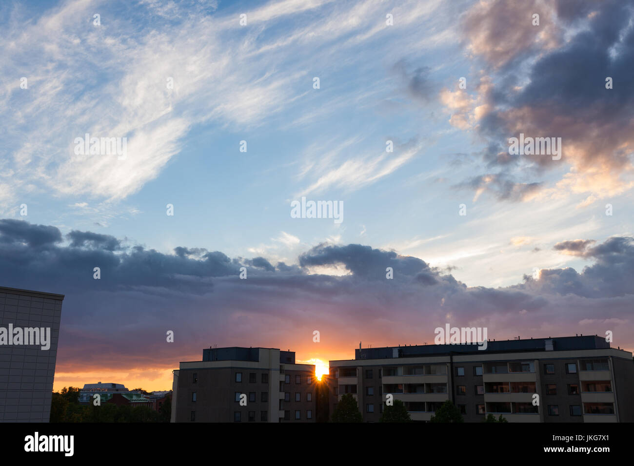 Sunset between buildings Stock Photo - Alamy