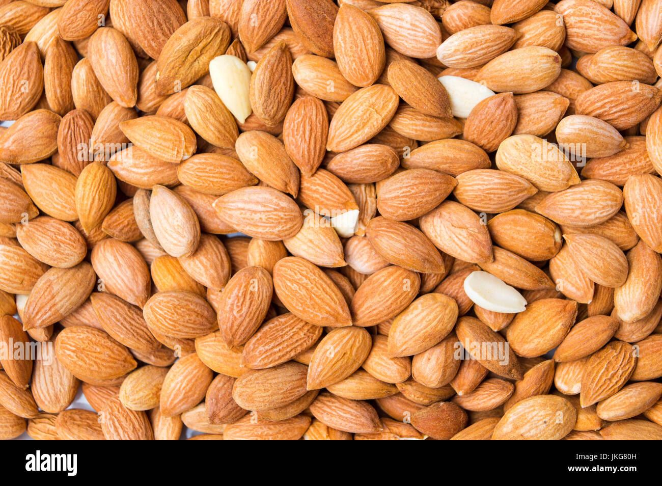 Bunch of apricot seeds forming background pattern Stock Photo - Alamy