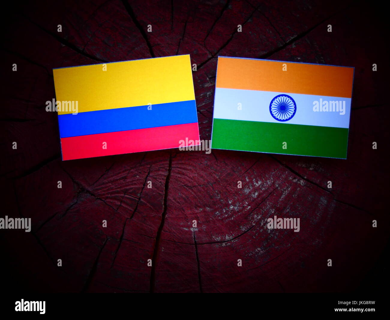 Colombian flag with Indian flag on a tree stump isolated Stock Photo ...