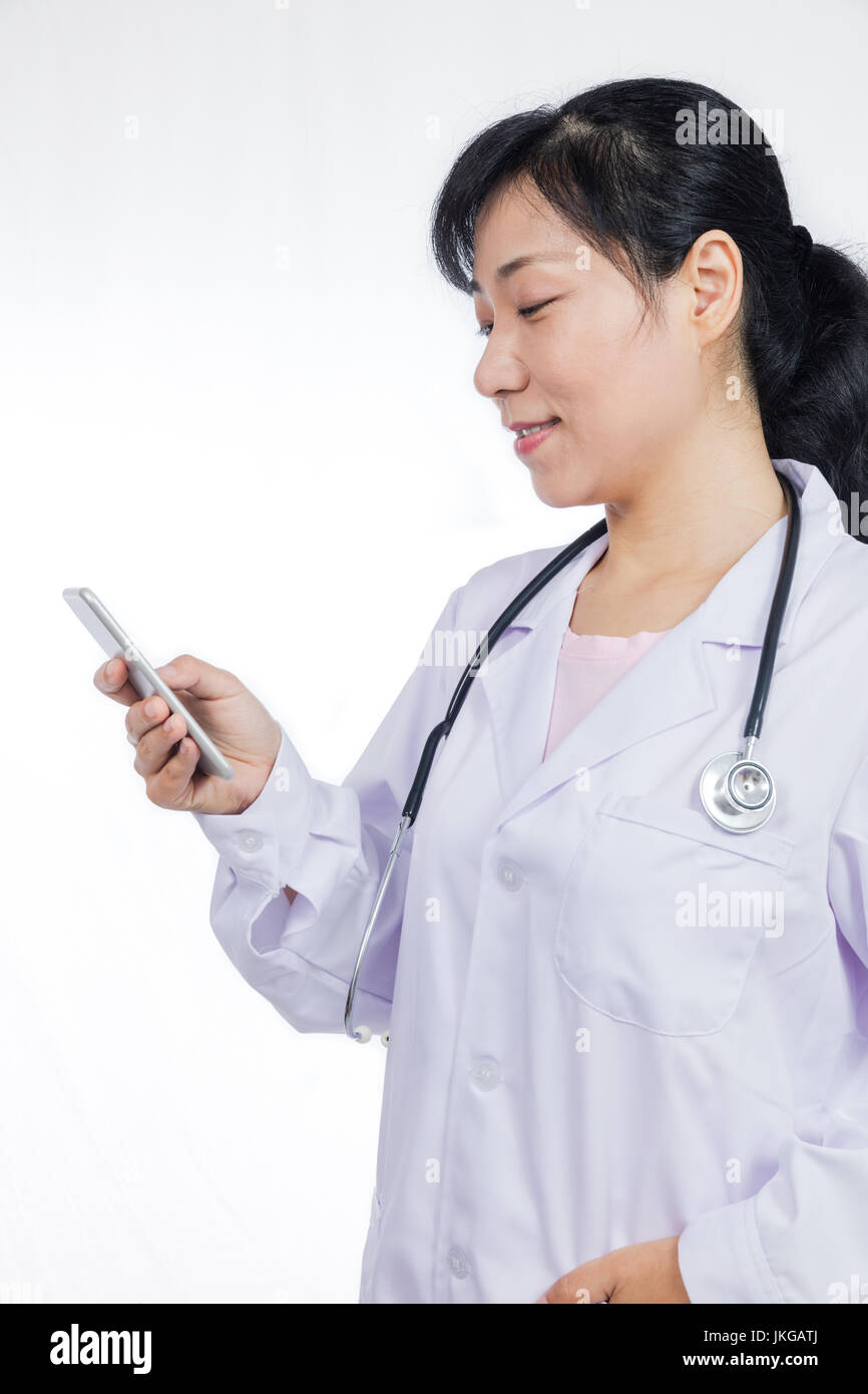Asian female doctor using mobile phone in isolated White Background ...
