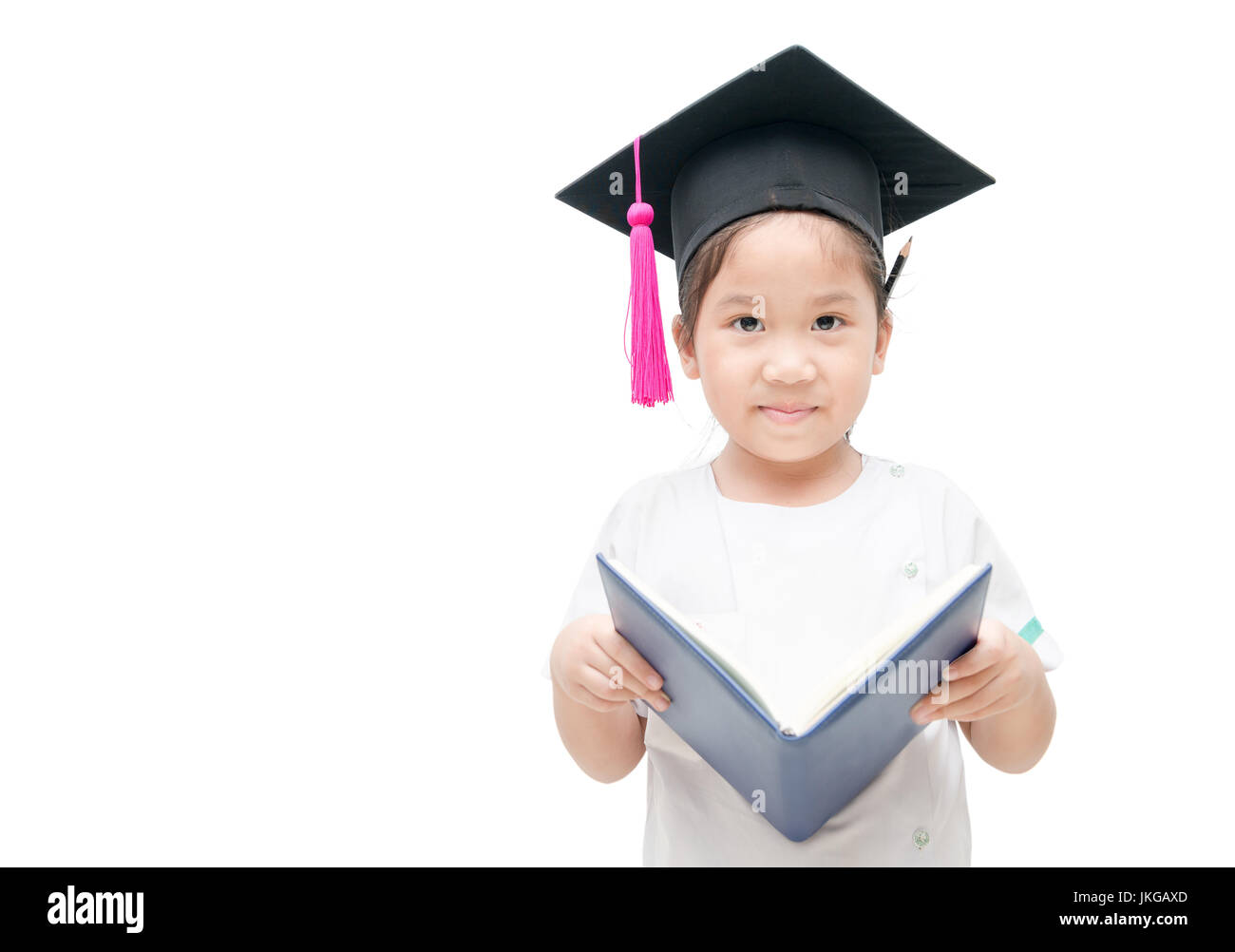 Happy Asian school kid graduate reading book with graduation cap ...