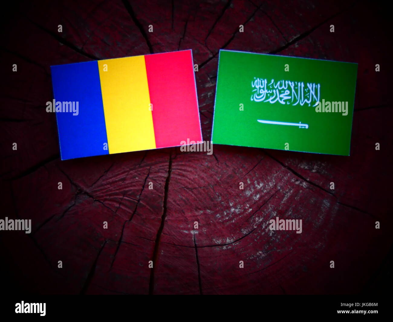 Chad flag with Saudi Arabian flag on a tree stump isolated Stock Photo ...
