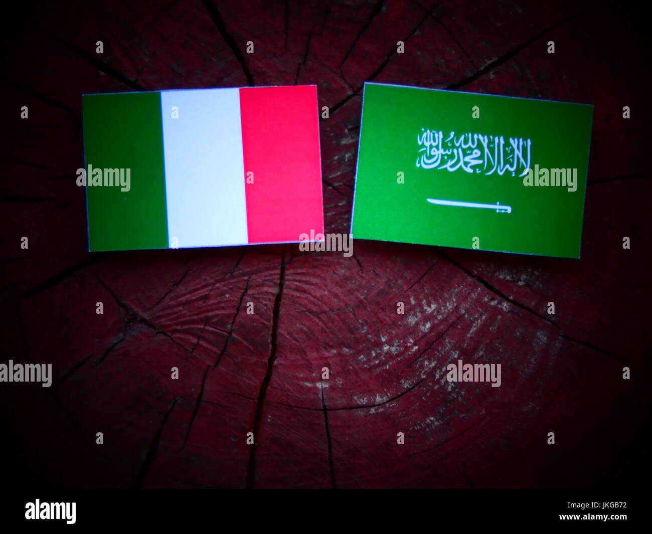 Italian flag with Saudi Arabian flag on a tree stump isolated Stock ...