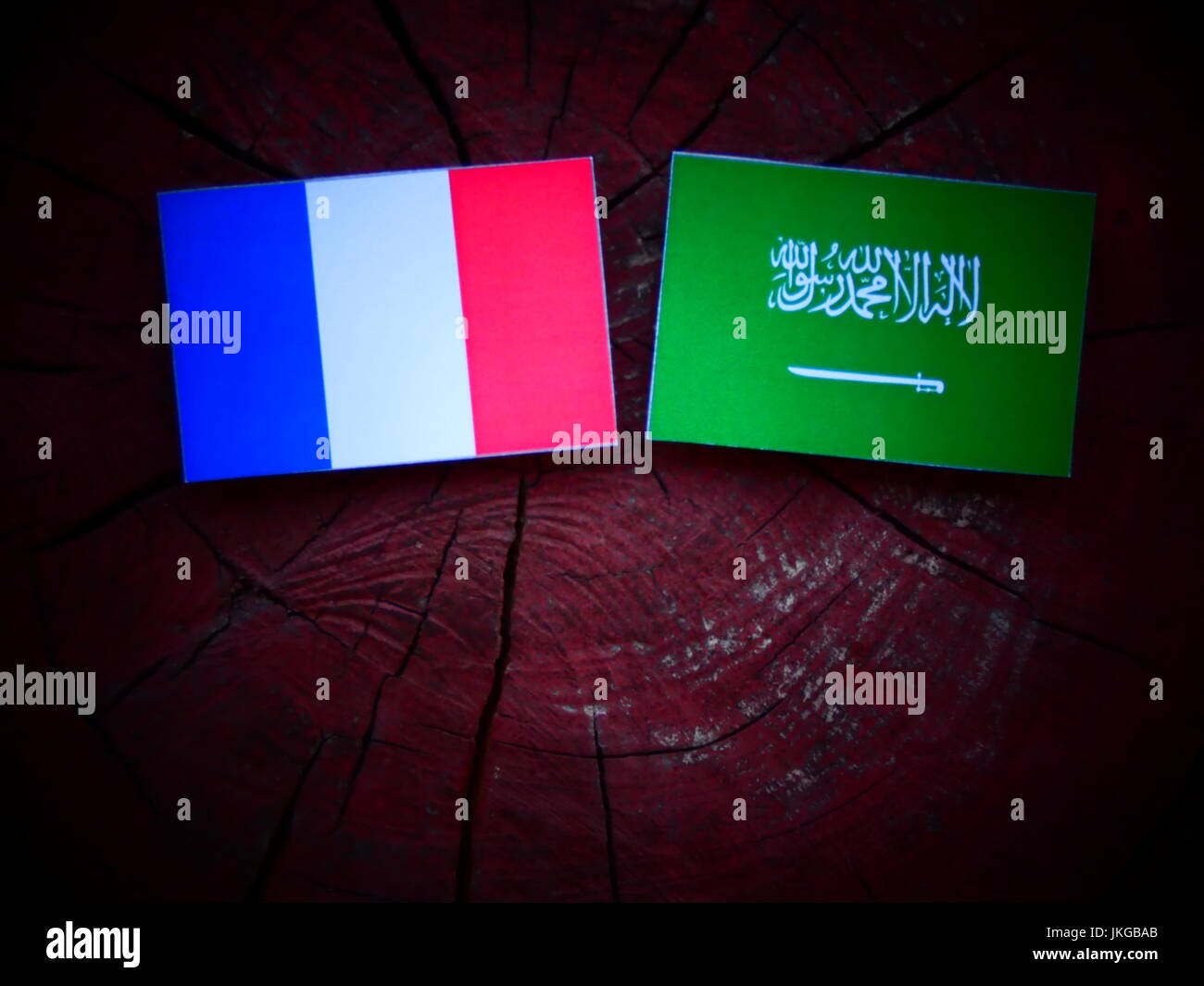 French flag with Saudi Arabian flag on a tree stump isolated Stock ...