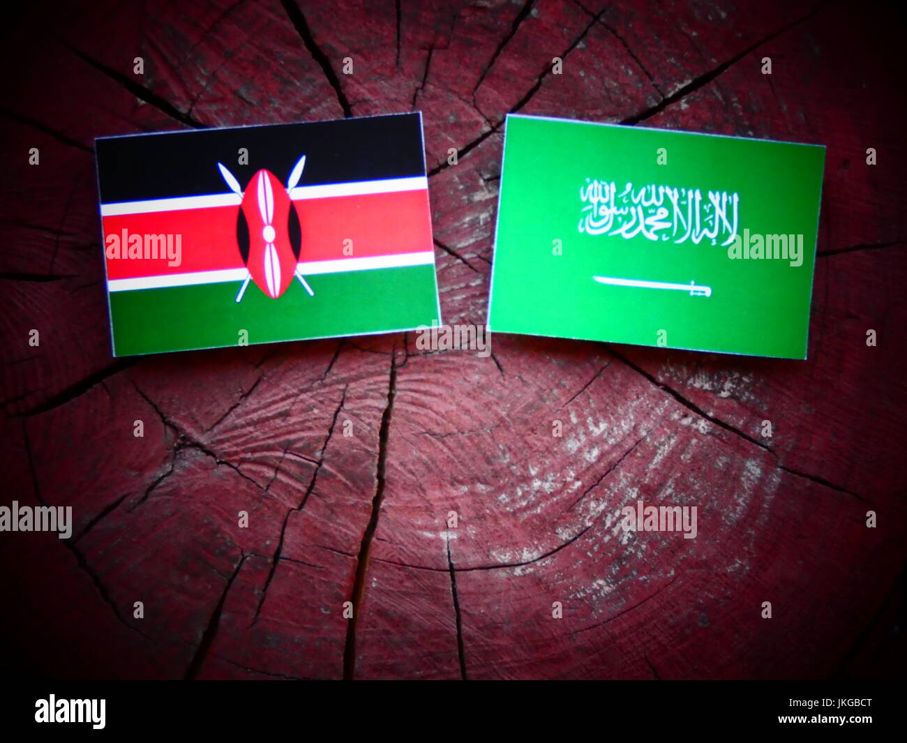 Kenyan flag with Saudi Arabian flag on a tree stump isolated Stock ...