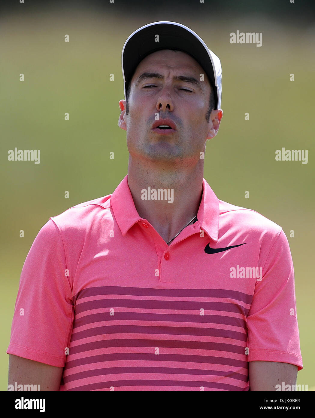 England's Ross Fisher reacts to a missed putt on the 1st on the 1st ...