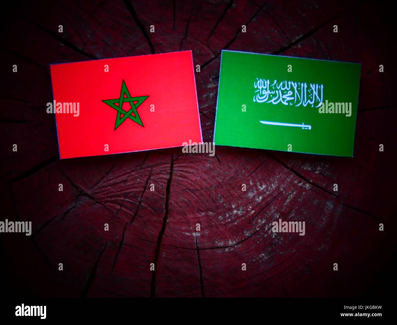 Moroccan flag with Saudi Arabian flag on a tree stump isolated Stock ...