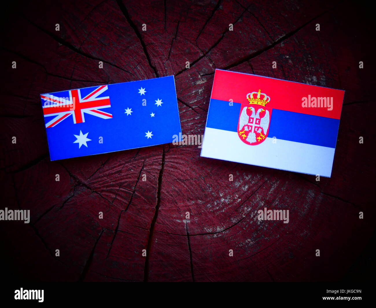 Australian flag with Serbian flag on a tree stump isolated Stock Photo ...