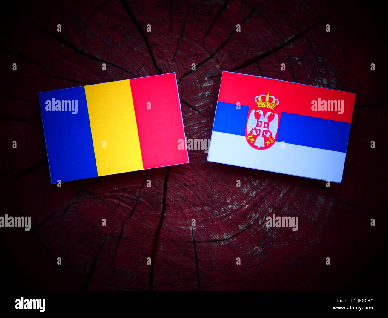 Chad flag with Serbian flag on a tree stump isolated Stock Photo - Alamy