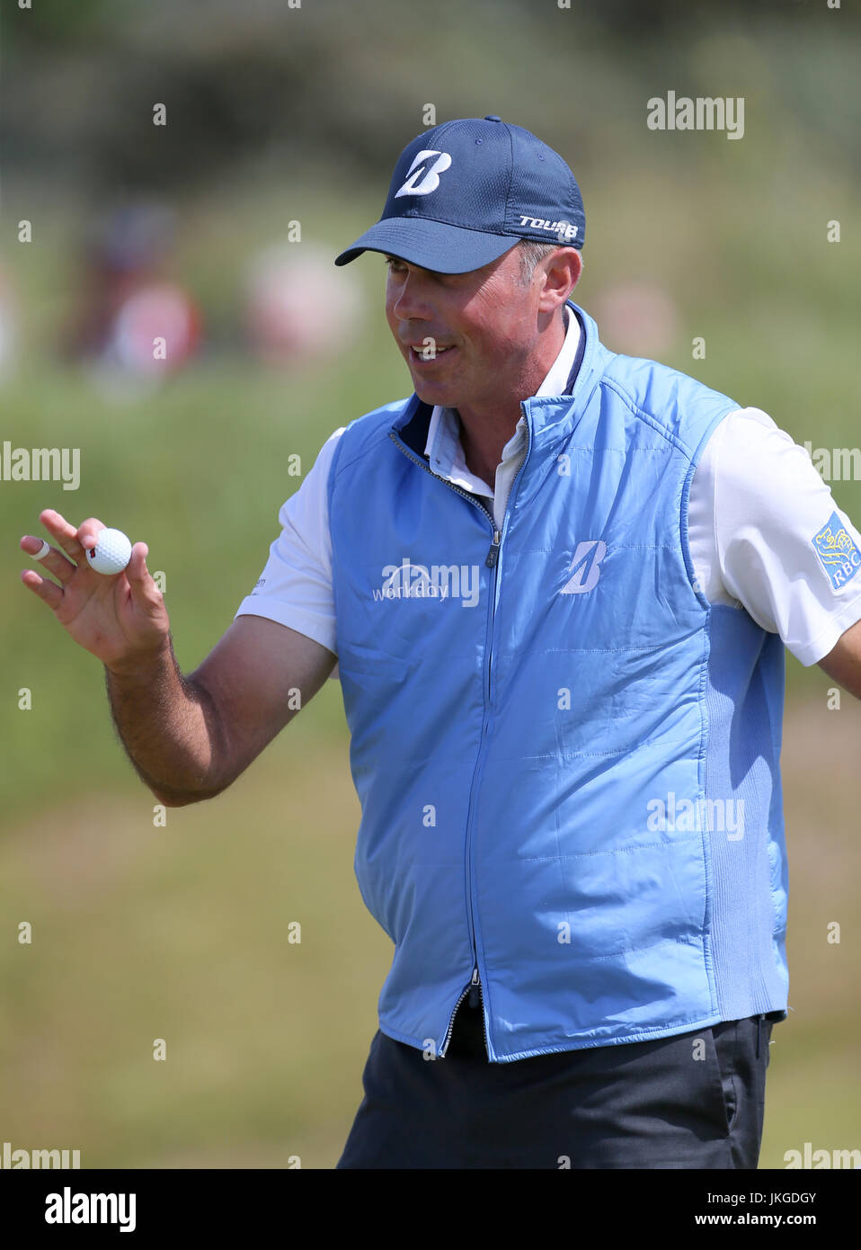 USA's Matt Kuchar holds the ball after putting on the 1st during day ...