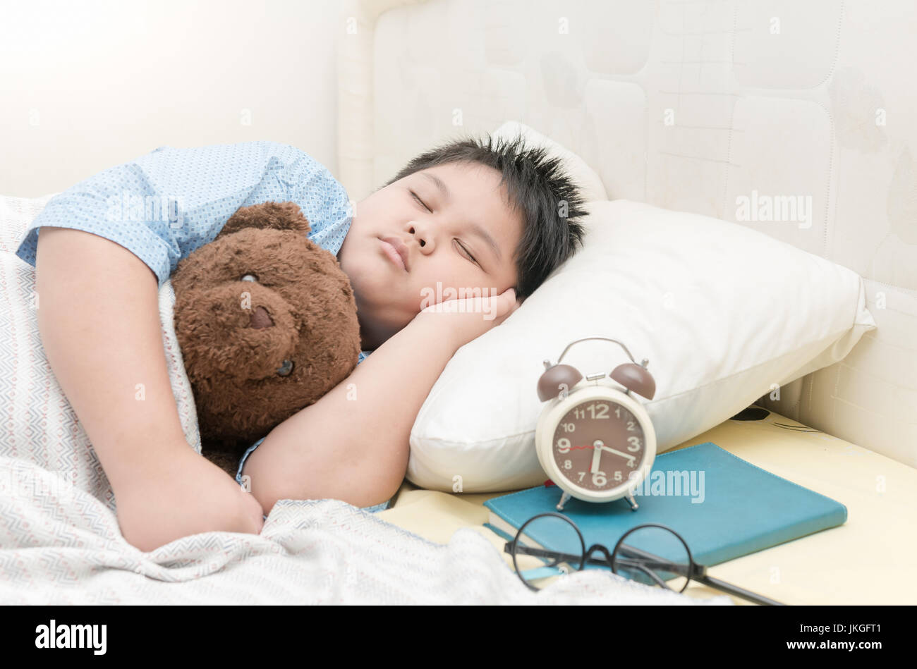 fat boy sleep and hug teddy bear on bed in morning Stock Photo - Alamy