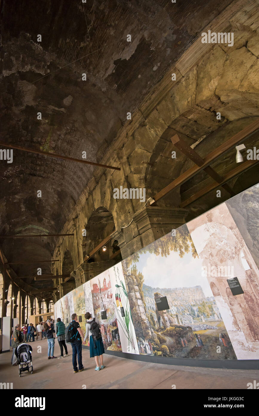 Vertical view of tourists looking at the exhibition inside the ...