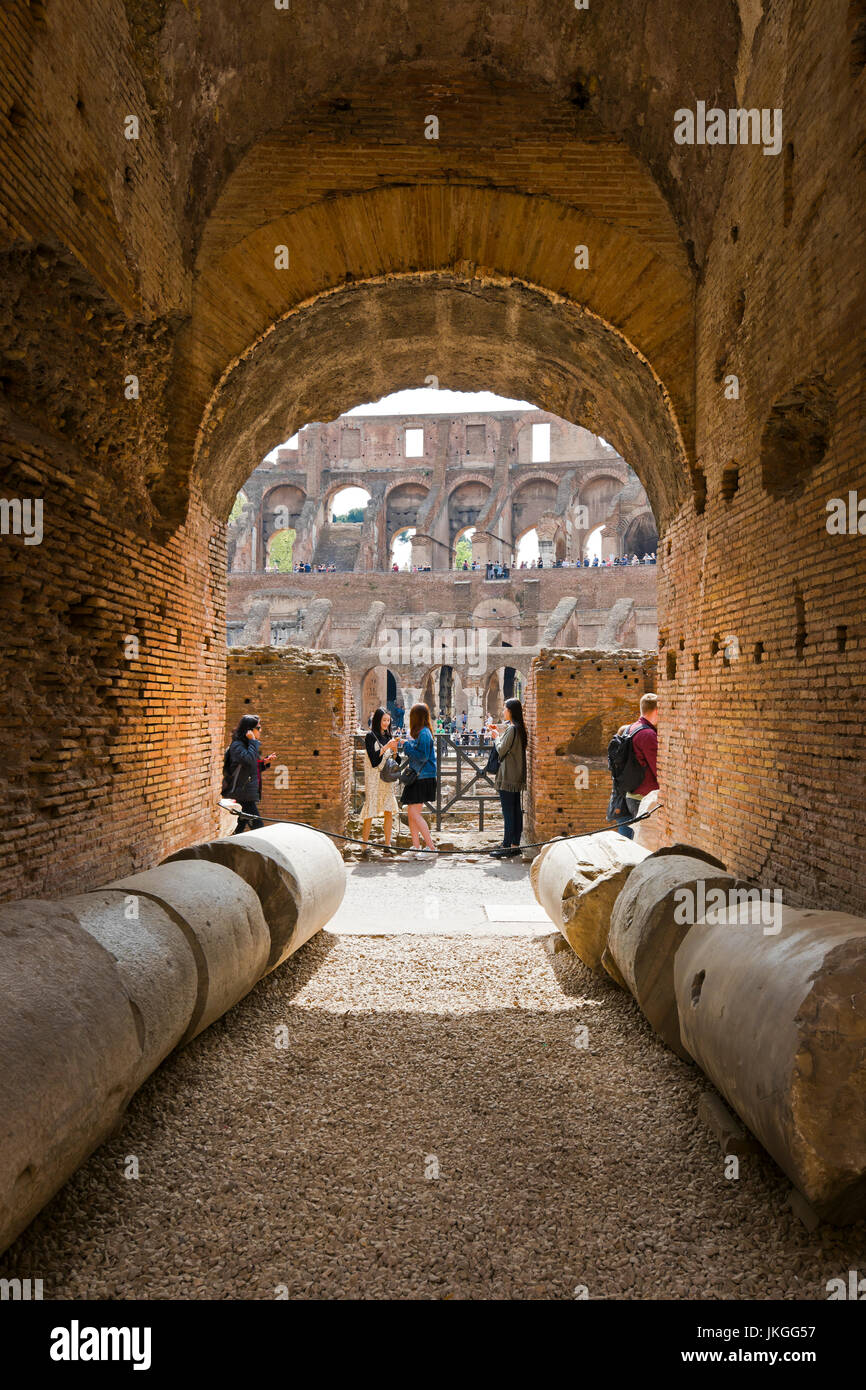 Vertical view through an arch inside the Colosseum in Rome Stock Photo ...