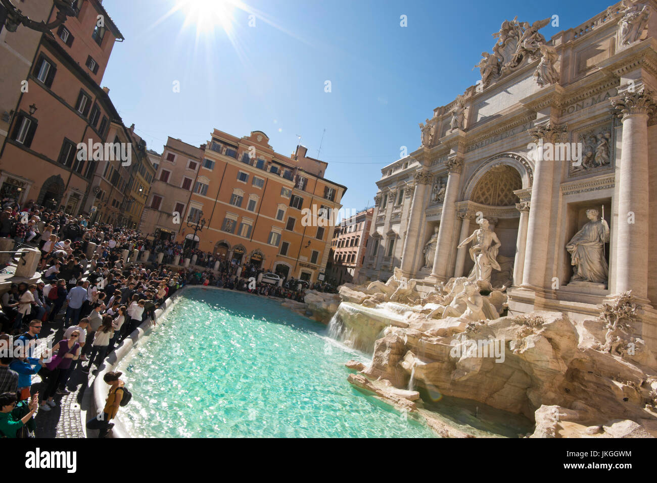 Horizontal view of tourists gathered around the Trevi Fountain in Rome ...
