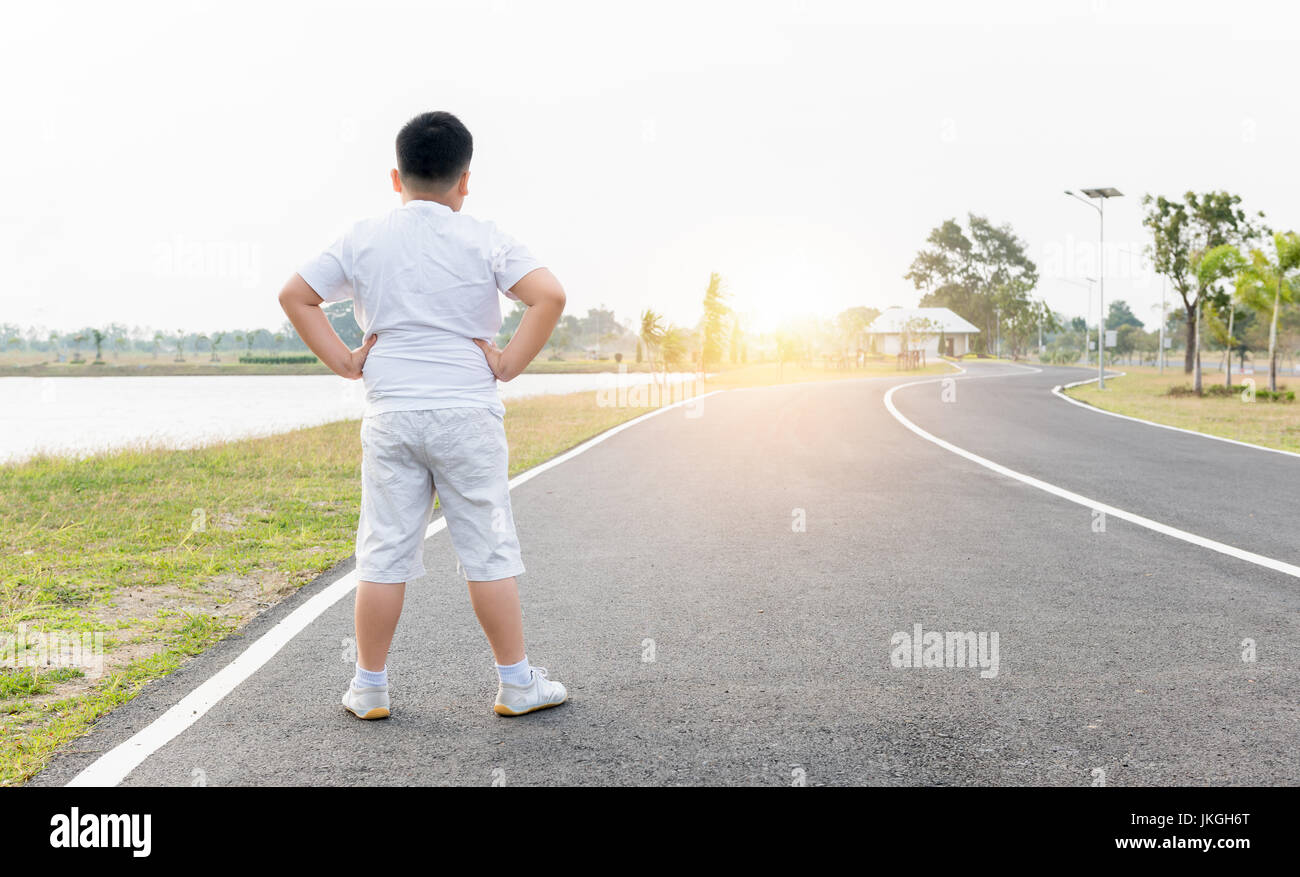 Obese fat boy exercise at park on morning, concept exercise and healthy ...