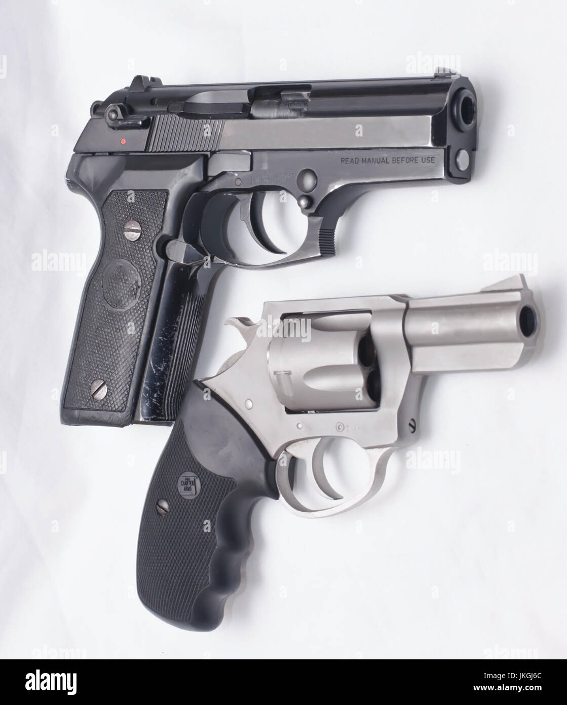 Black semi auto pistol with a stainless revolver Stock Photo - Alamy