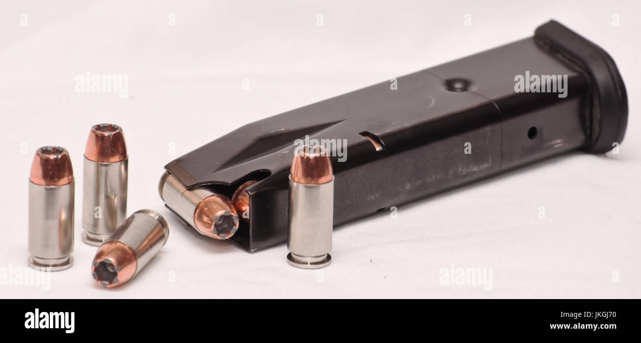 Loaded pistol magazine with several bullets not loaded Stock Photo - Alamy