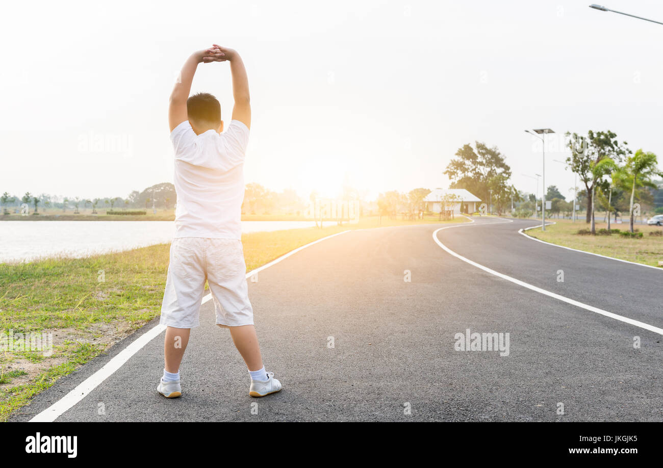 Obese fat boy exercise at park on morning, concept exercise and healthy ...