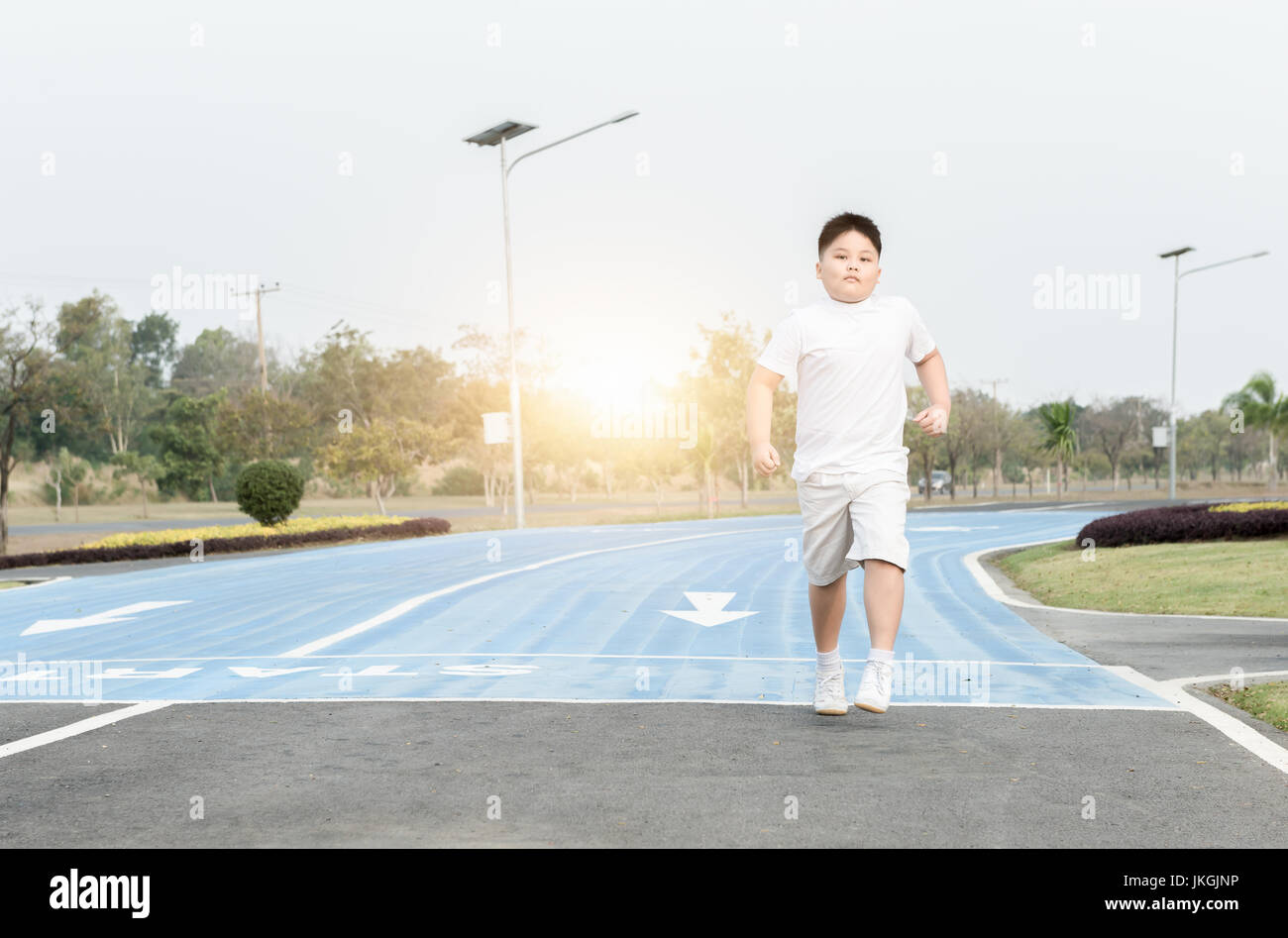 Obese fat boy running on park, concept exercise and healthy Stock Photo ...