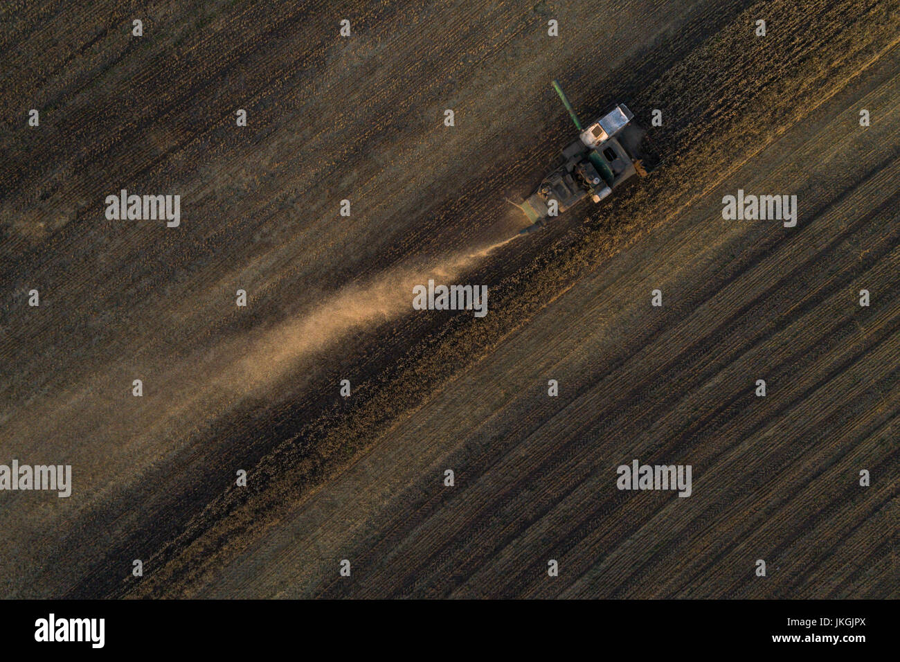 Harvester machine working in field . Combine harvester agriculture ...