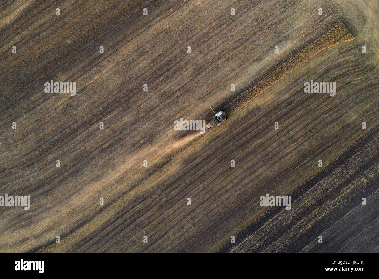 Harvester machine working in field . Combine harvester agriculture ...