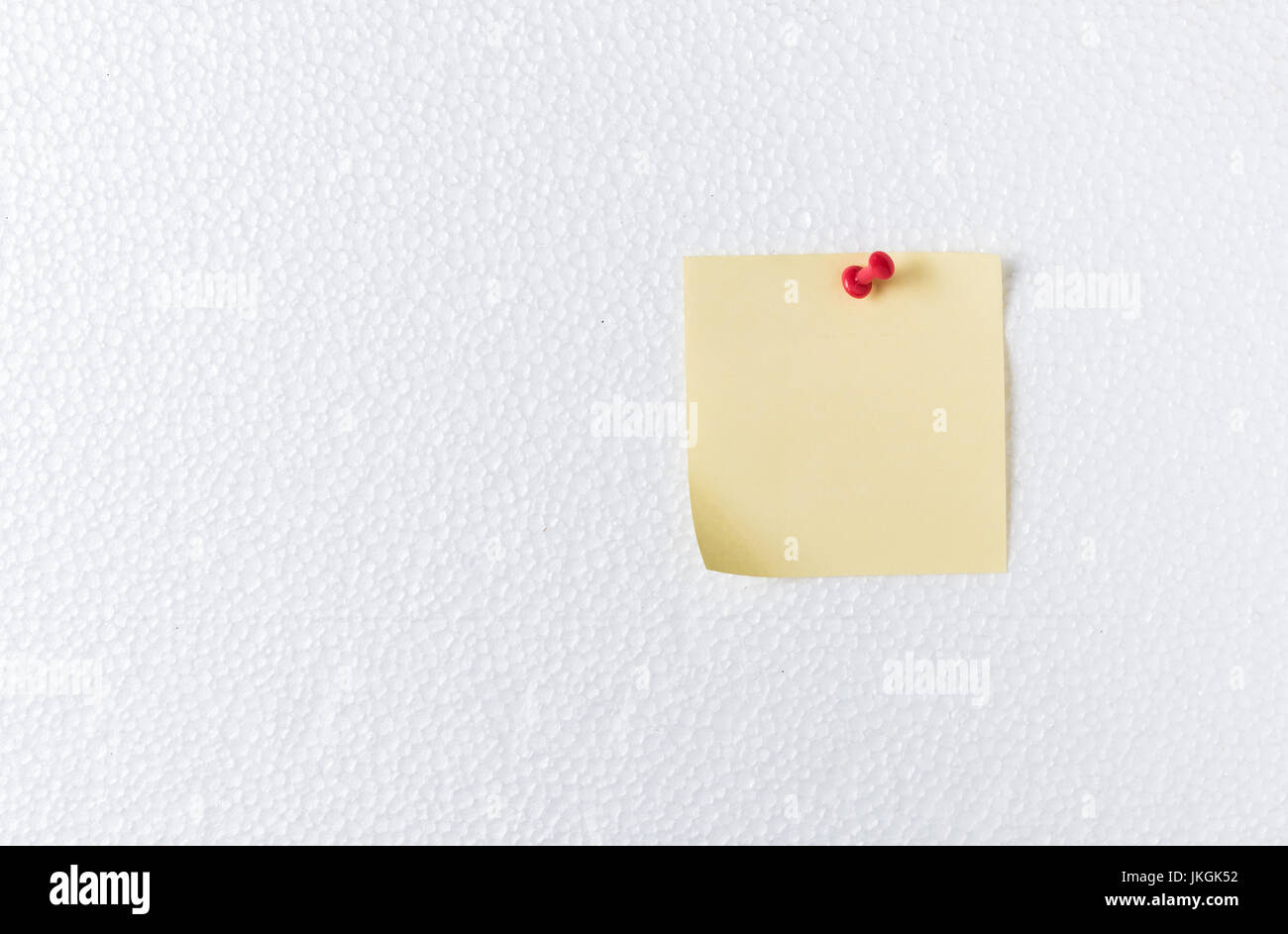 pink paper note with pin on foam sheet, concept remember and memory ...