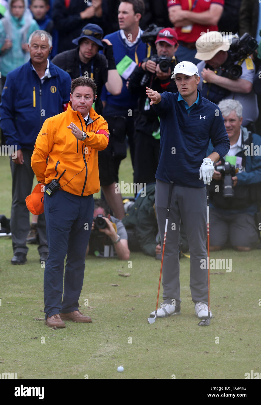 USA's Jordan Spieth repositions his ball on the driving range behind ...