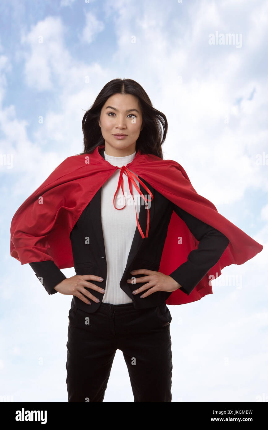 business woman wearing a super hero cape shot in the studio Stock Photo ...