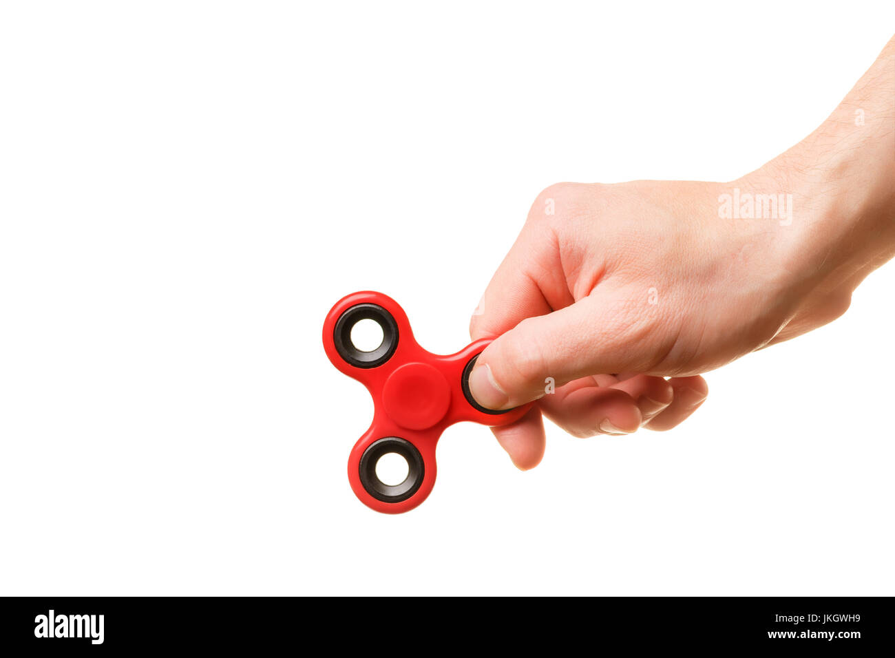 Male hand holding red spinner isolated on white background Stock Photo ...