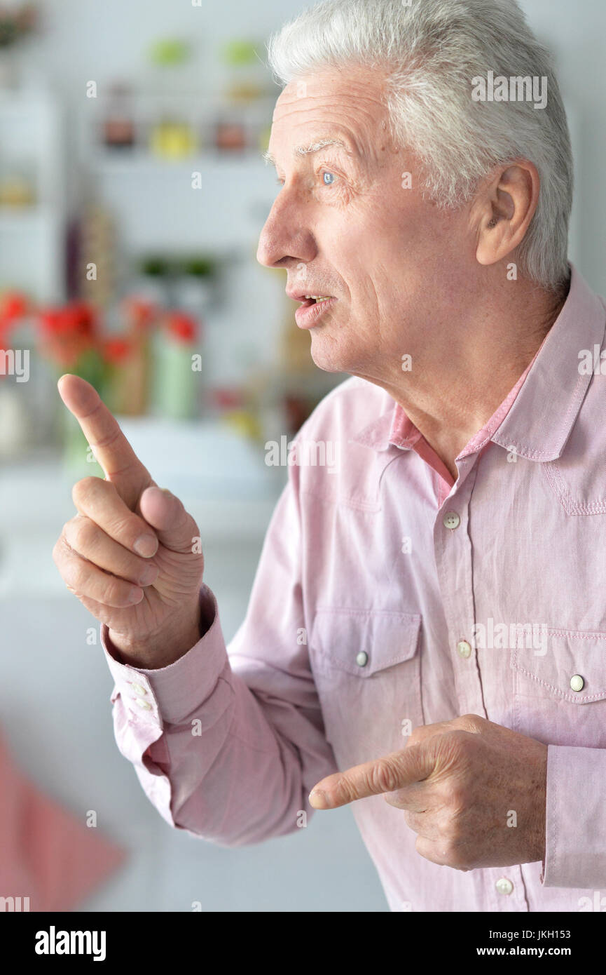 Mature old man pointing fingers hi-res stock photography and images - Alamy