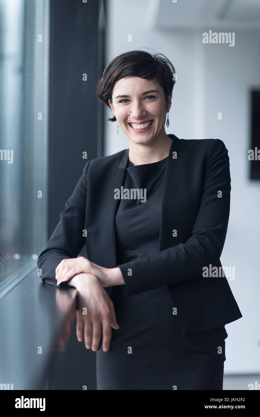 Portrait Of Successful Businesswoman by the window Entrepreneur At Busy ...