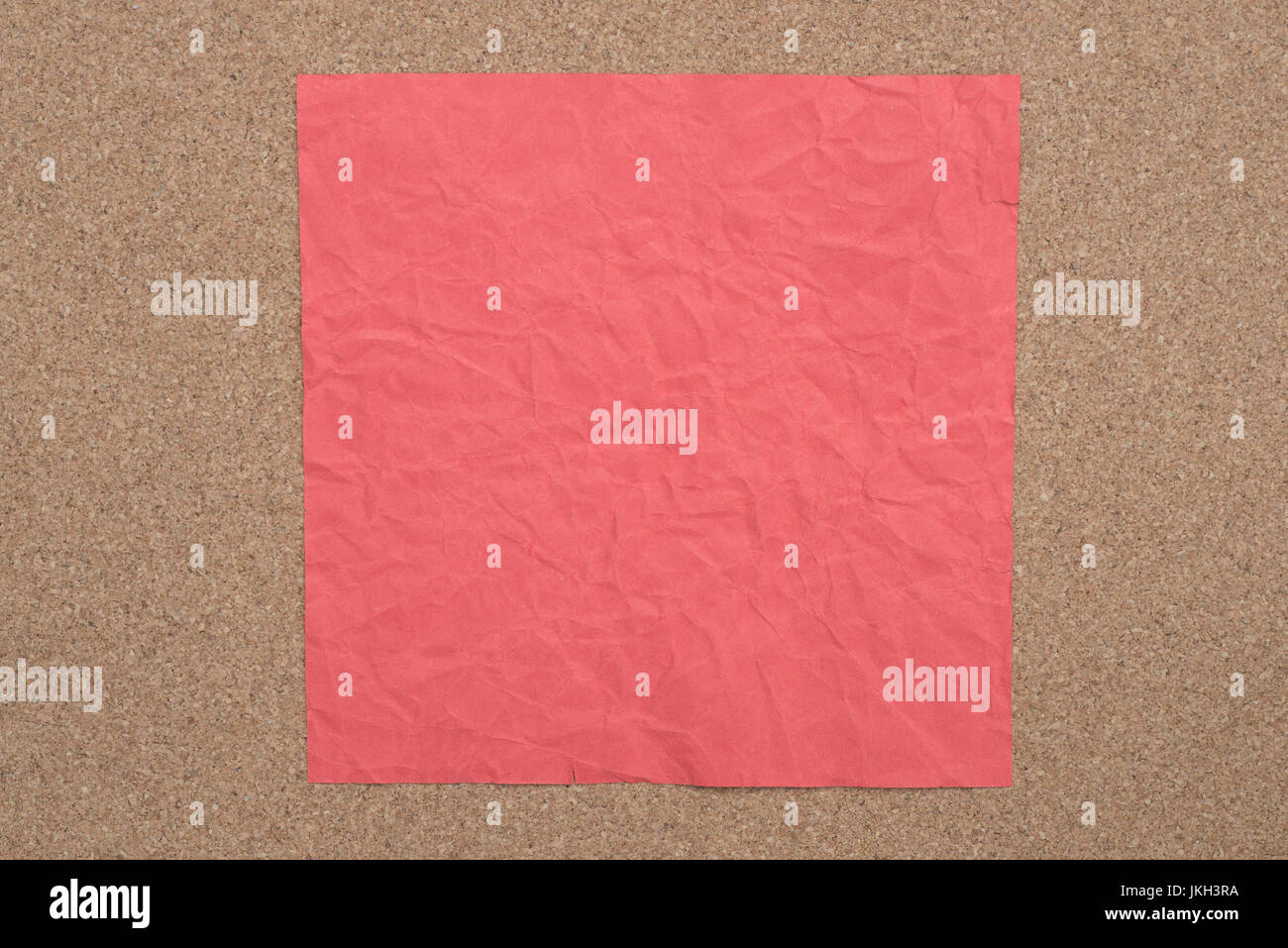 red color creased paper note on cork background Stock Photo - Alamy
