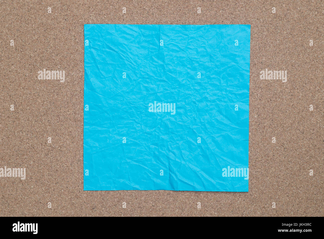 blue color creased paper note on cork background Stock Photo - Alamy