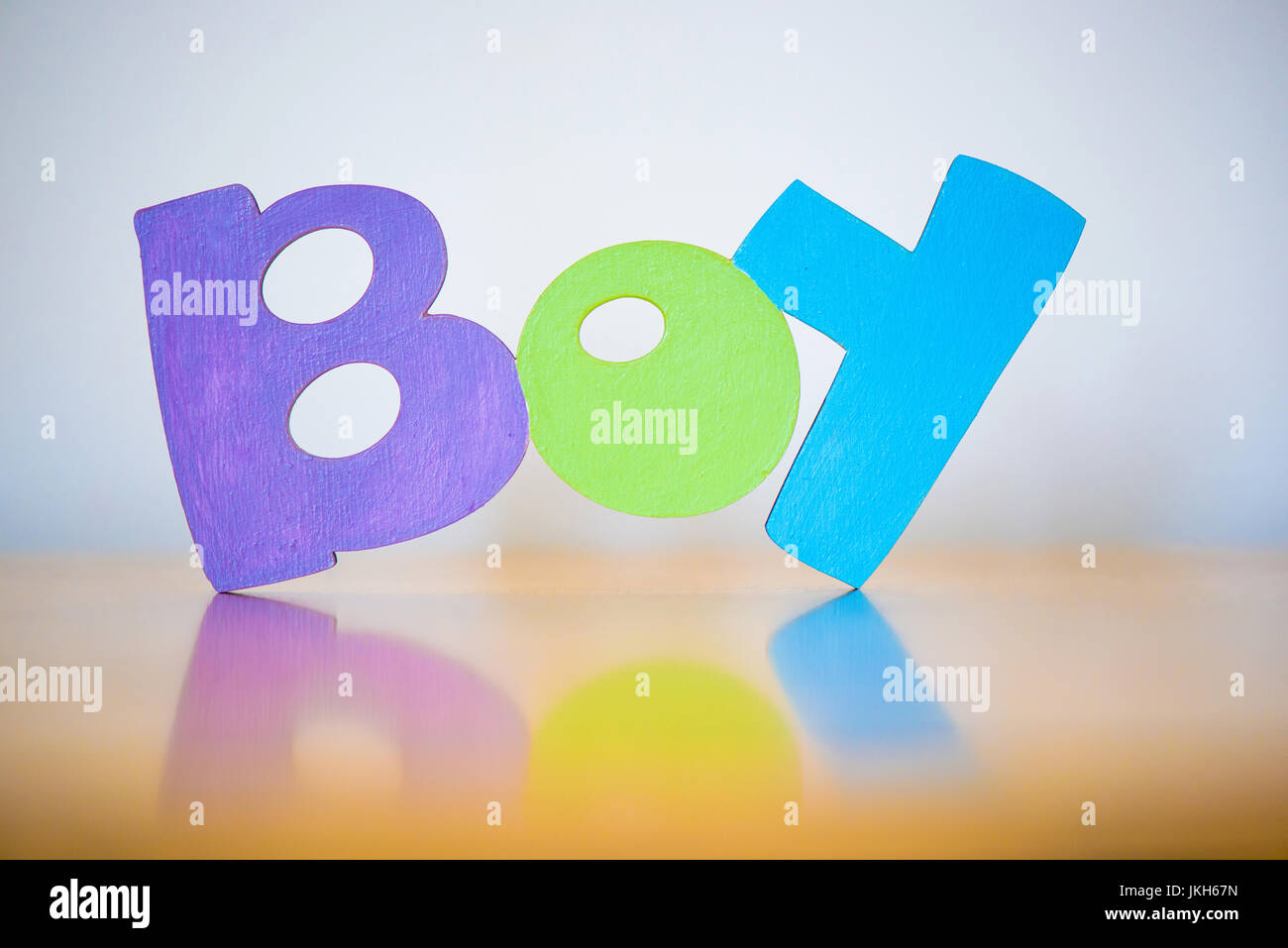 Text BOY multi-colored wooden letters of the alphabet Stock Photo - Alamy