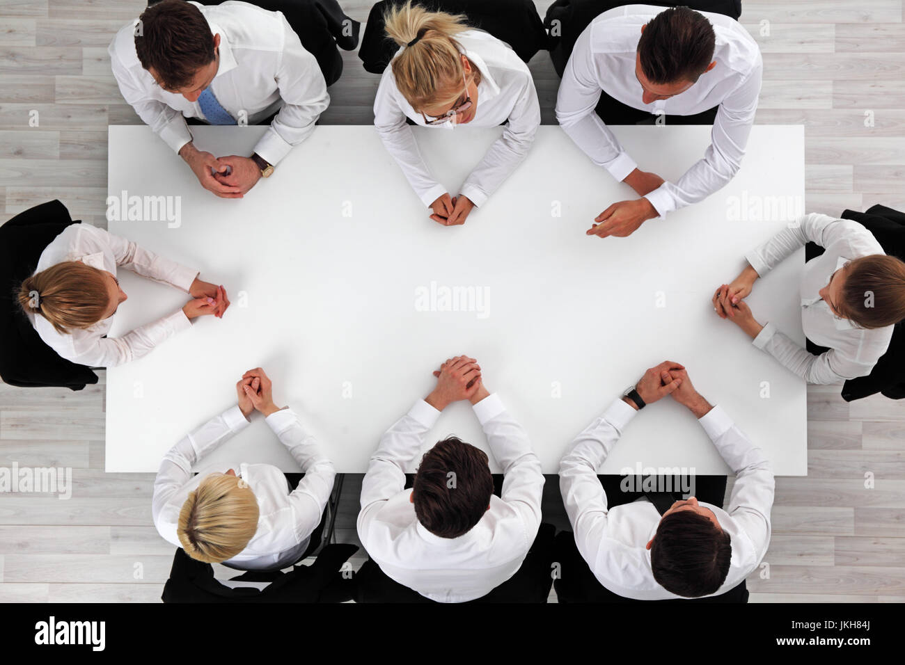 Businessmen sitting around table hi-res stock photography and images ...