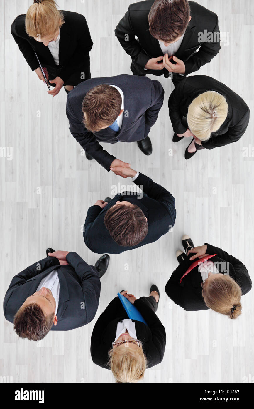 Business people shaking hands, finishing up a meeting, top view Stock ...