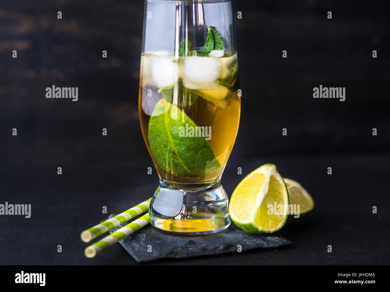 Summer drink glass of water with ice on dark background Stock Photo - Alamy