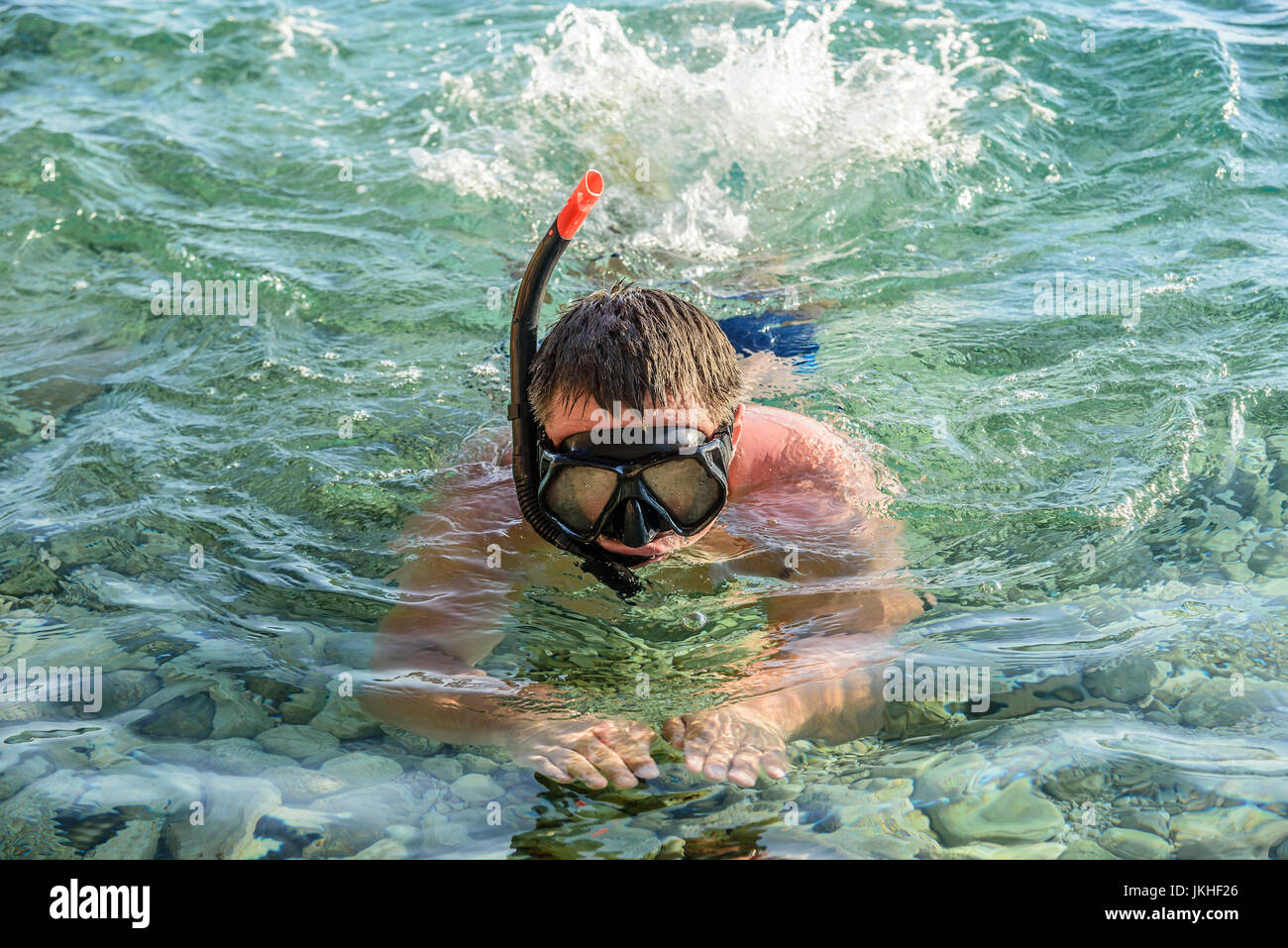 Man in a diving mask in sea water Stock Photo - Alamy