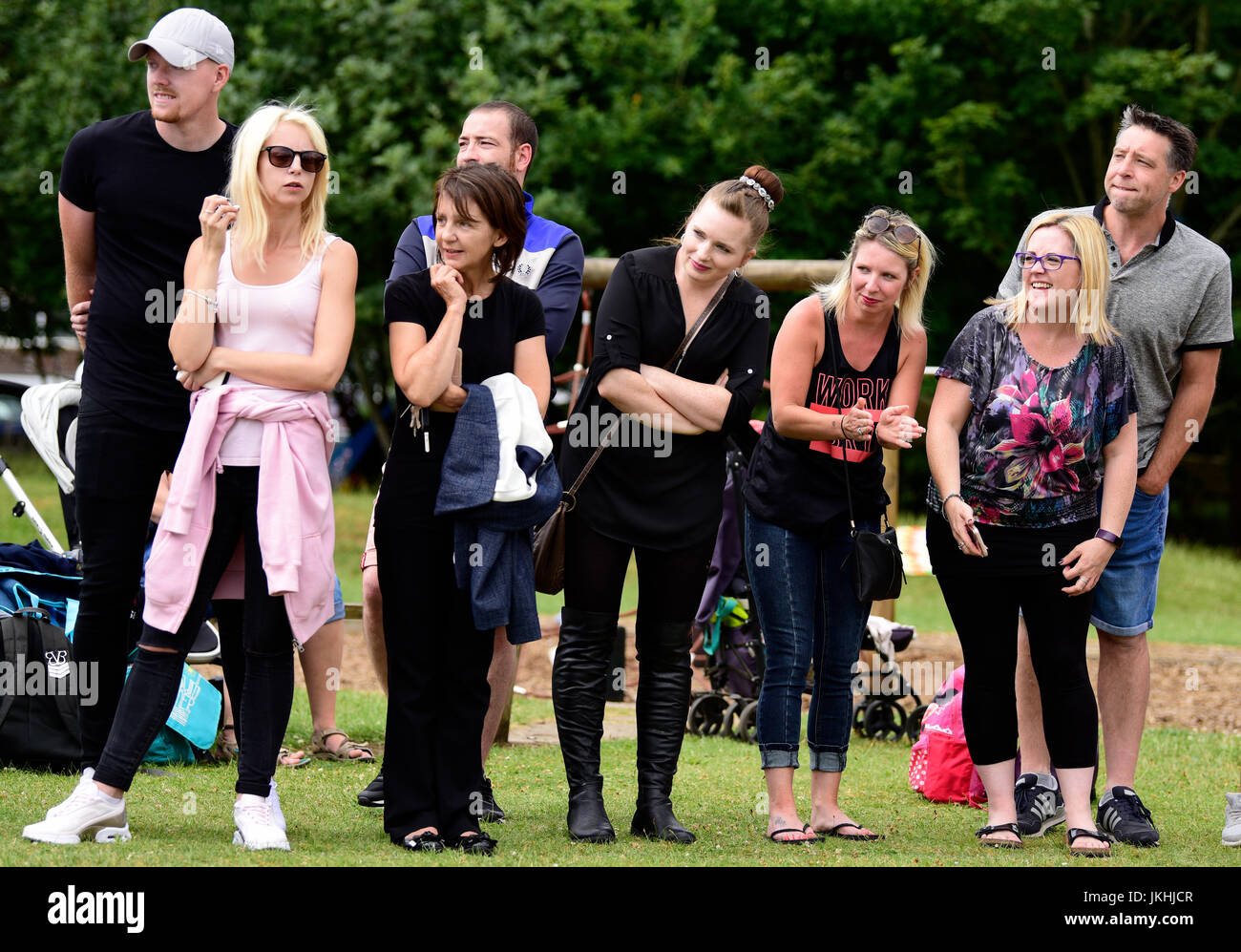 Parents watching their kids run at an infants school sports day, Bordon ...