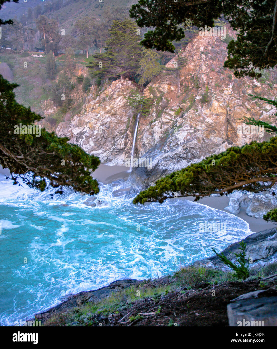 Foliage is dropping into a shot of the waterfall Stock Photo - Alamy