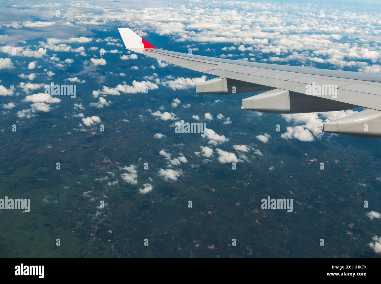 The view from the height of the window jet aircraft. white cloud and ...