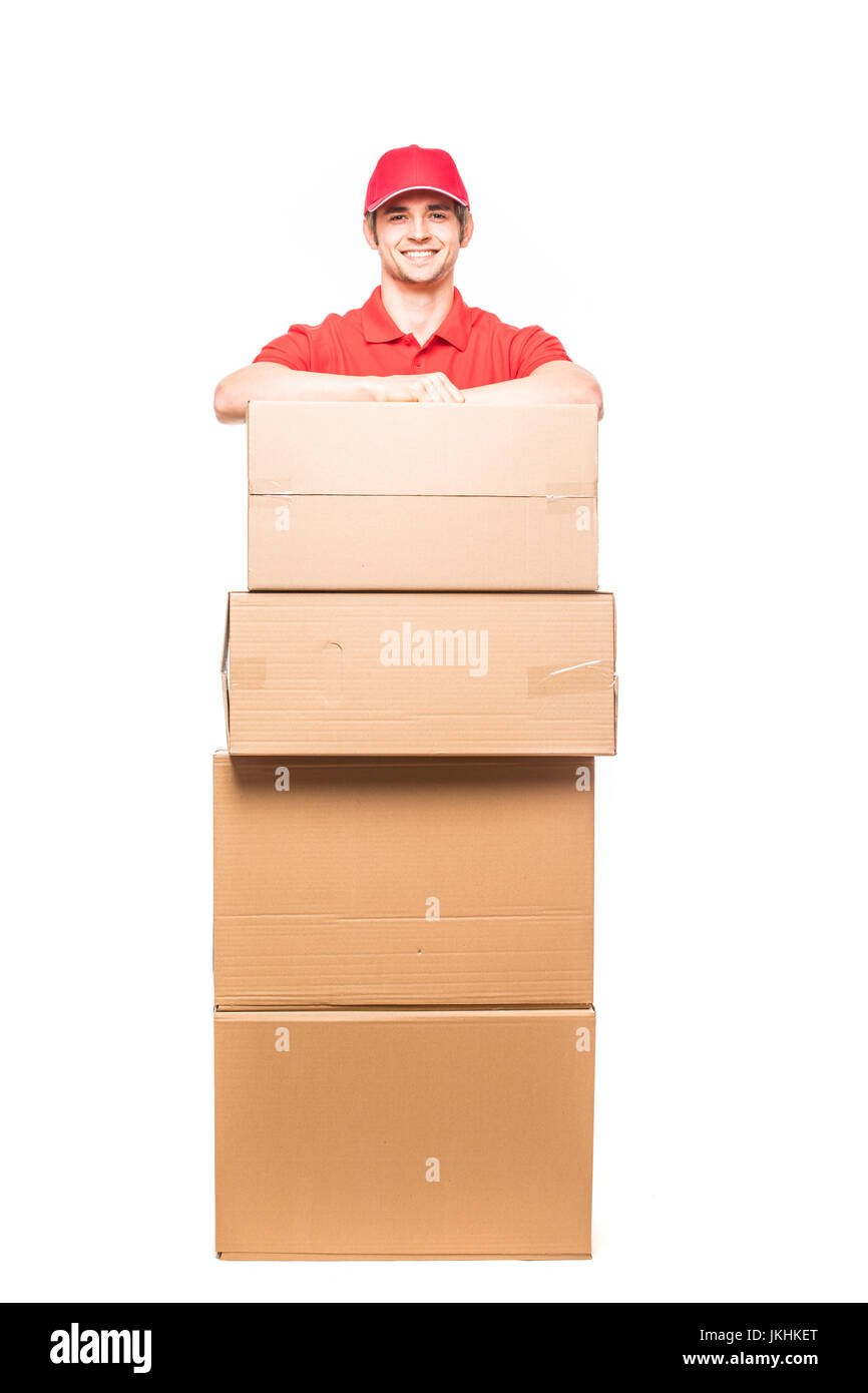 Handsome young delivery man with boxes on white background Stock Photo ...