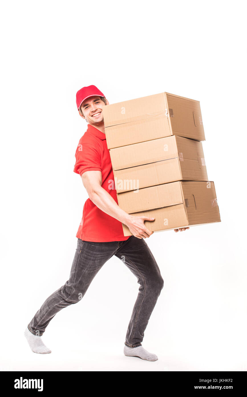 Delivery Man carries hard boxes on white background Stock Photo - Alamy