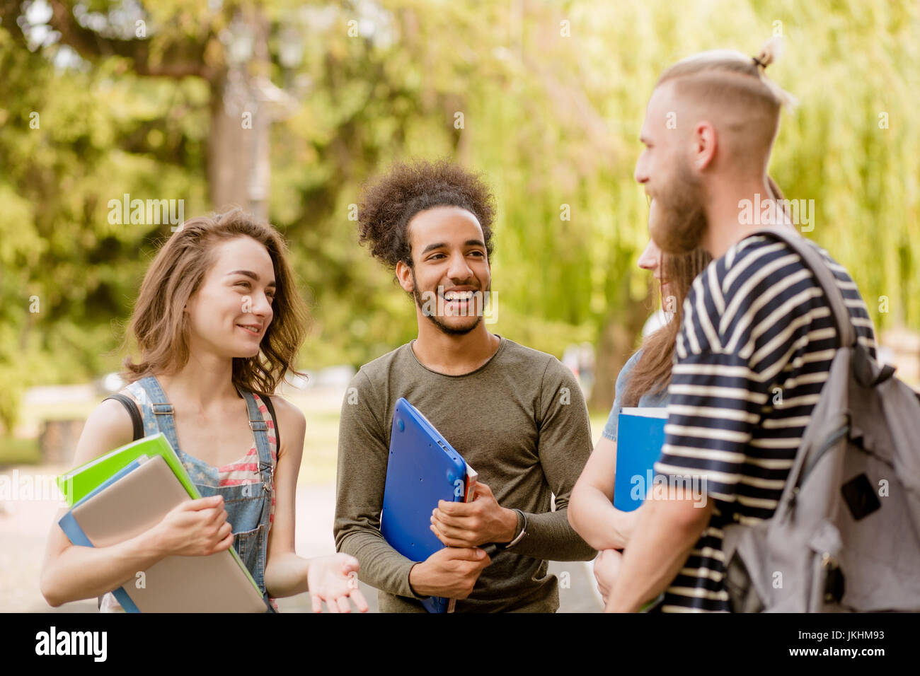 Students in campus communacating, laughing Stock Photo - Alamy