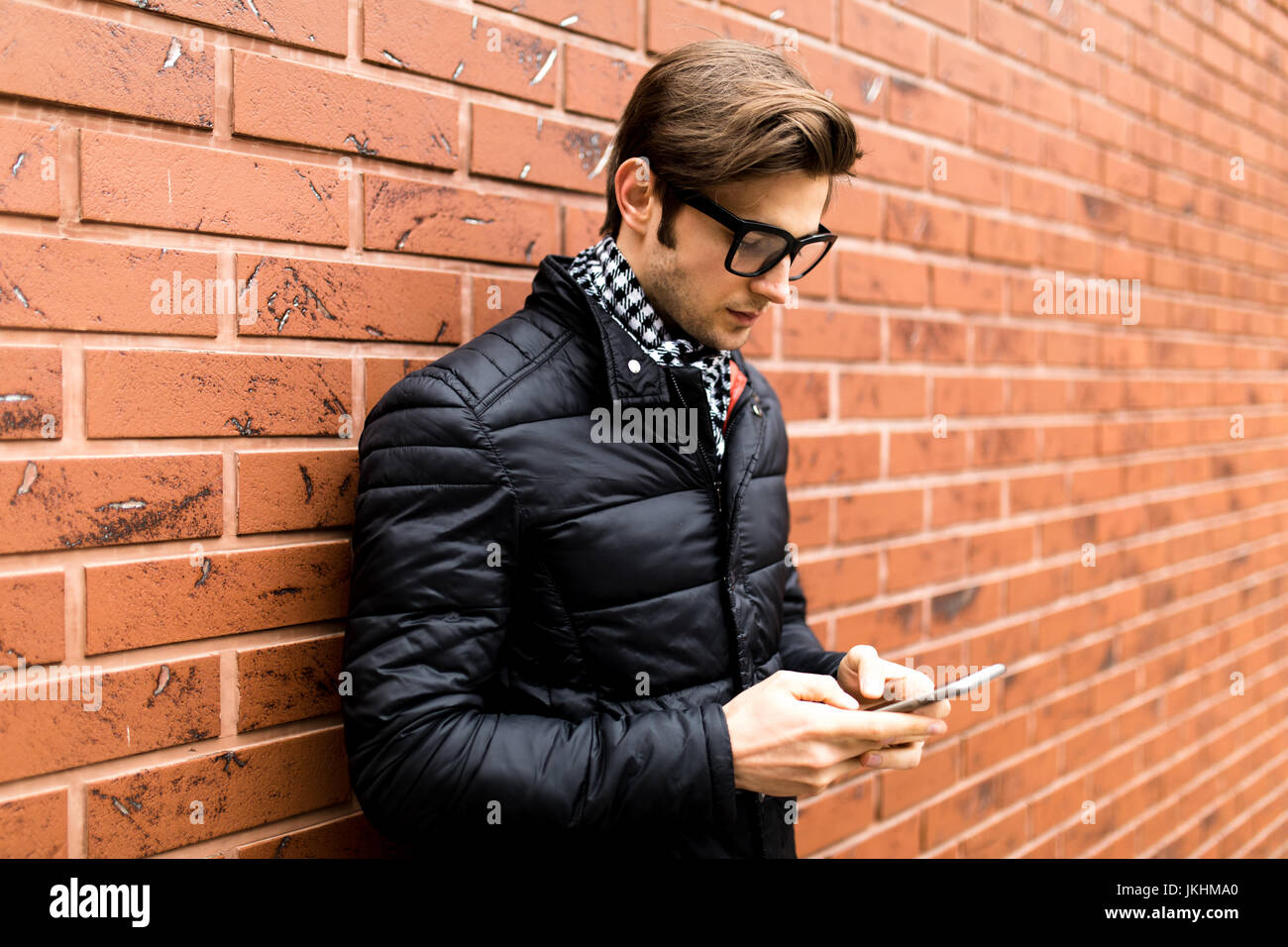 Typing text message side view of handsome young man in smart casual ...