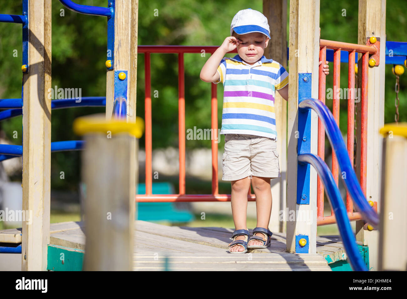 Boy crying on playground hi-res stock photography and images - Alamy